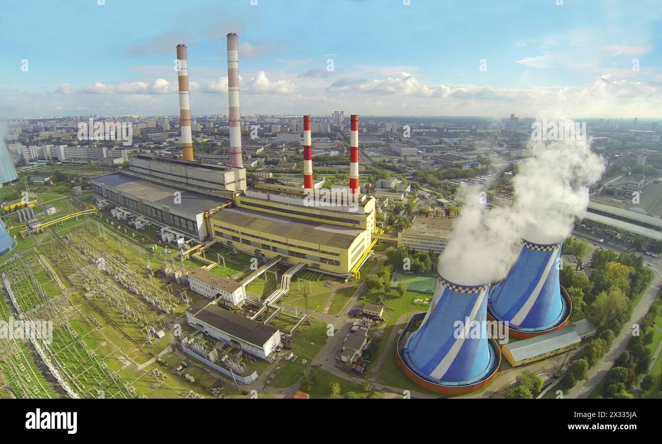 Territory of power plant with many pipes at sunny day. View from ...