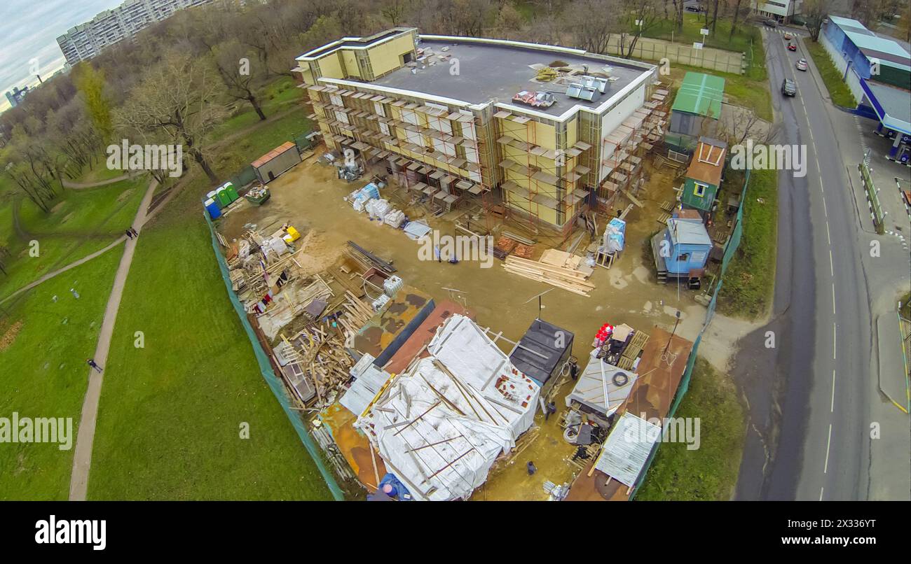 Builders are working on cladding of the building, view from unmanned ...