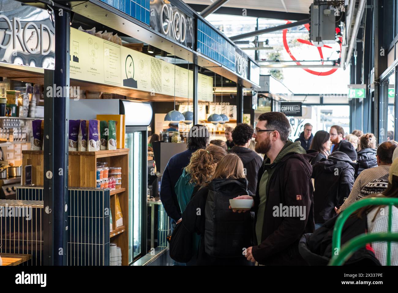 Copenhagen, Denmark - April 5, 2024: People queing at Grød porridge ...