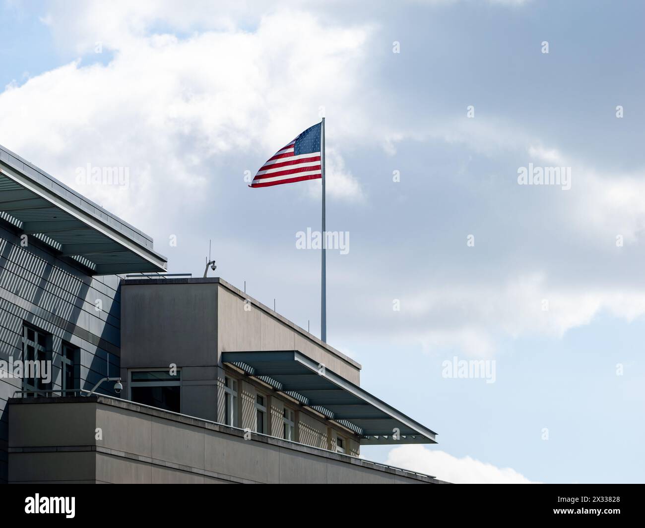 Flag of the United States (USA) on the rooftop of the embassy building ...