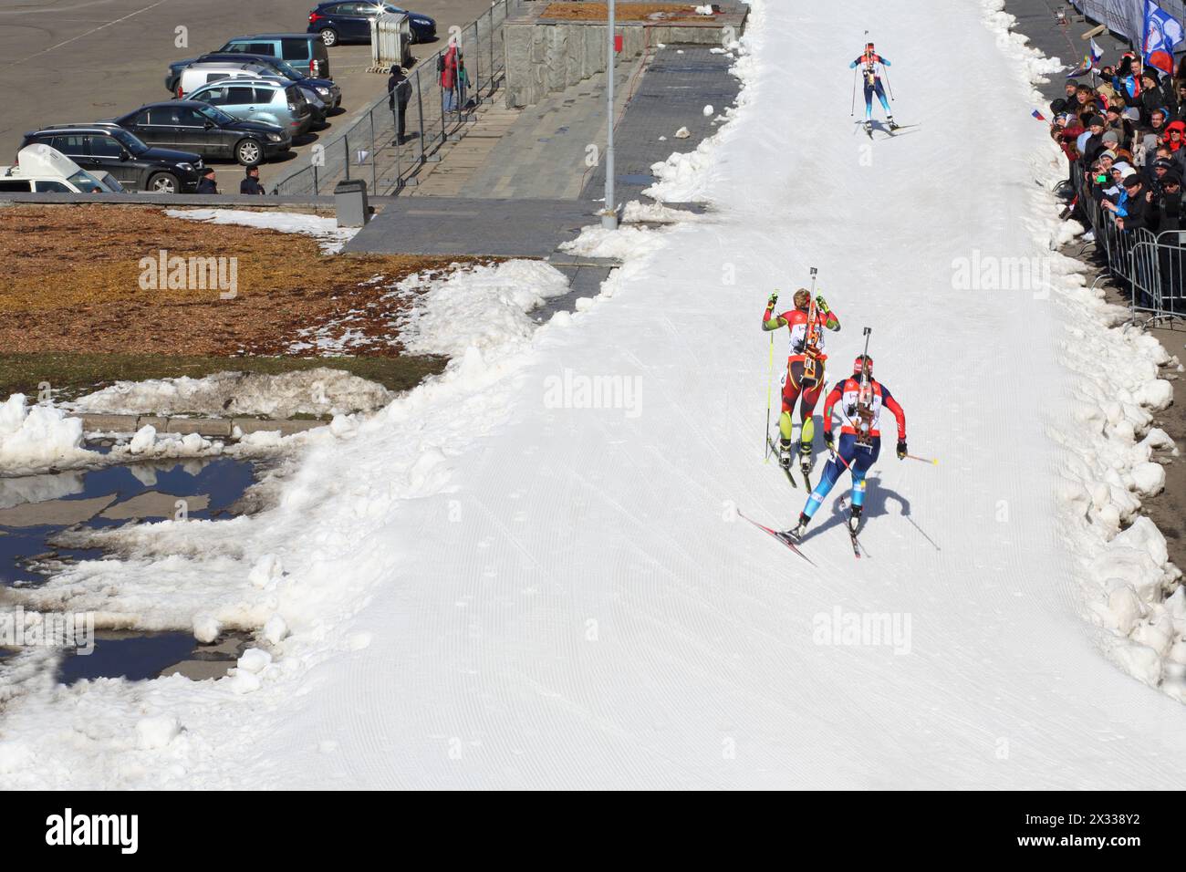MOSCOW - APR 05, 2014: Three biathlete running distance on the Race of ...