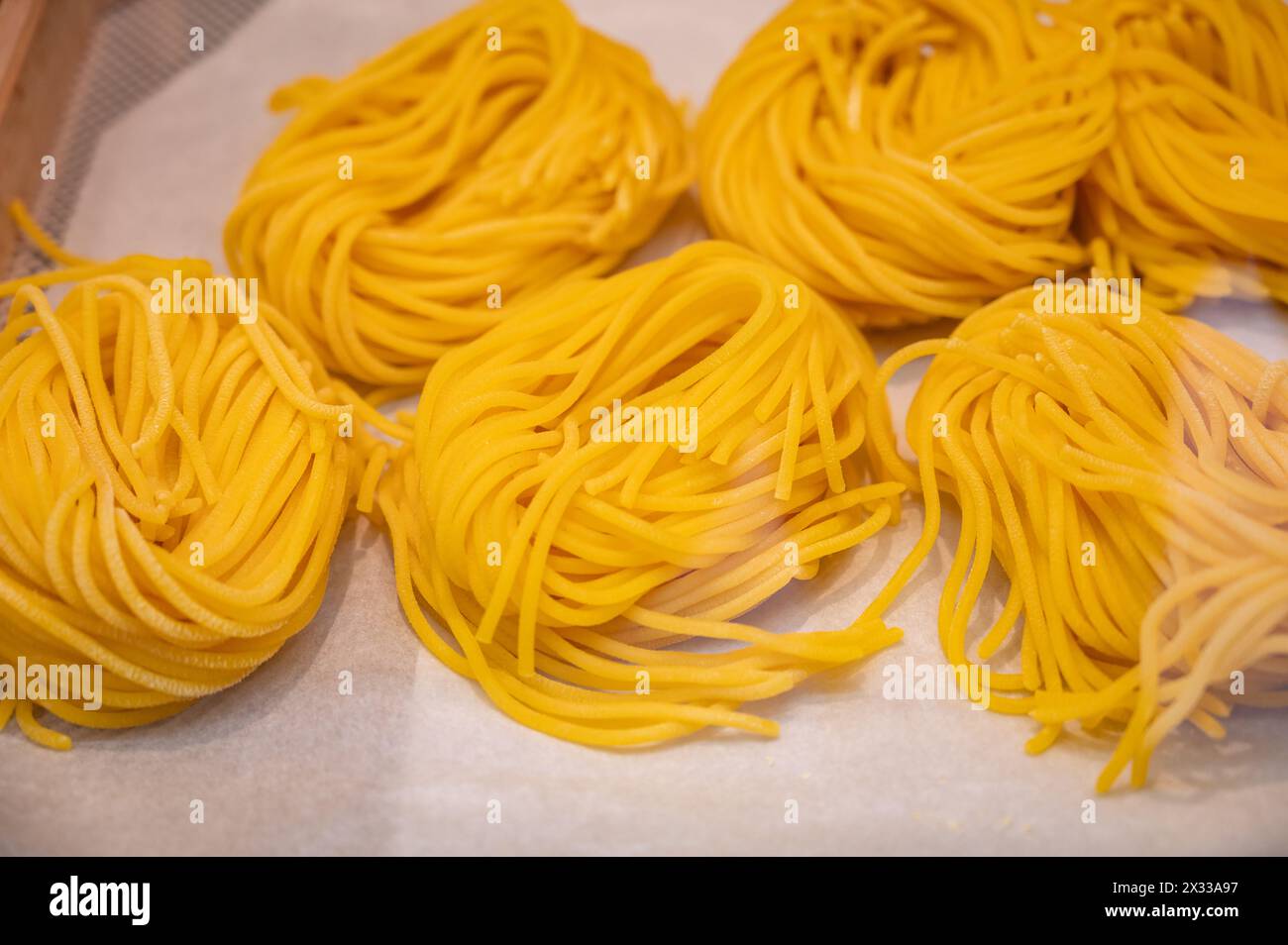 Italian food, fresh homemade yellow pasta with eggs ready to cook on ...