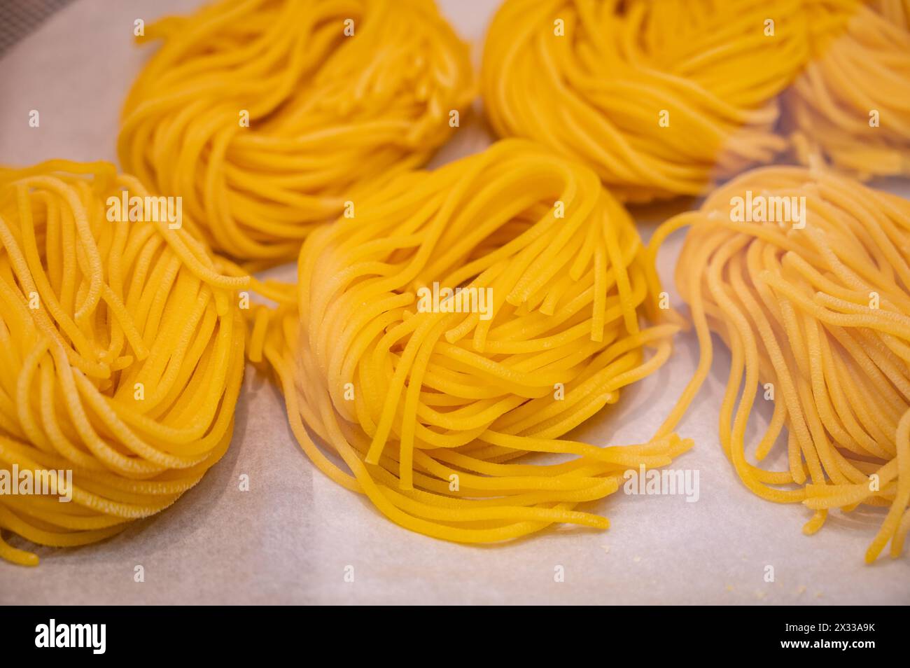 Italian food, fresh homemade yellow pasta with eggs ready to cook on ...