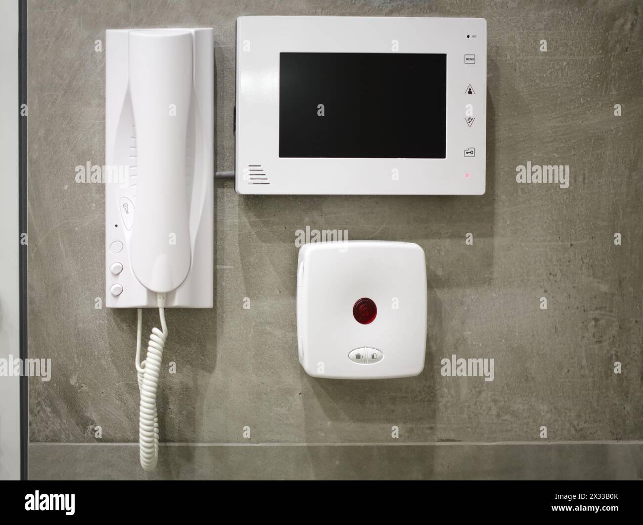 White plastic video intercom is hanging on the wall Stock Photo - Alamy