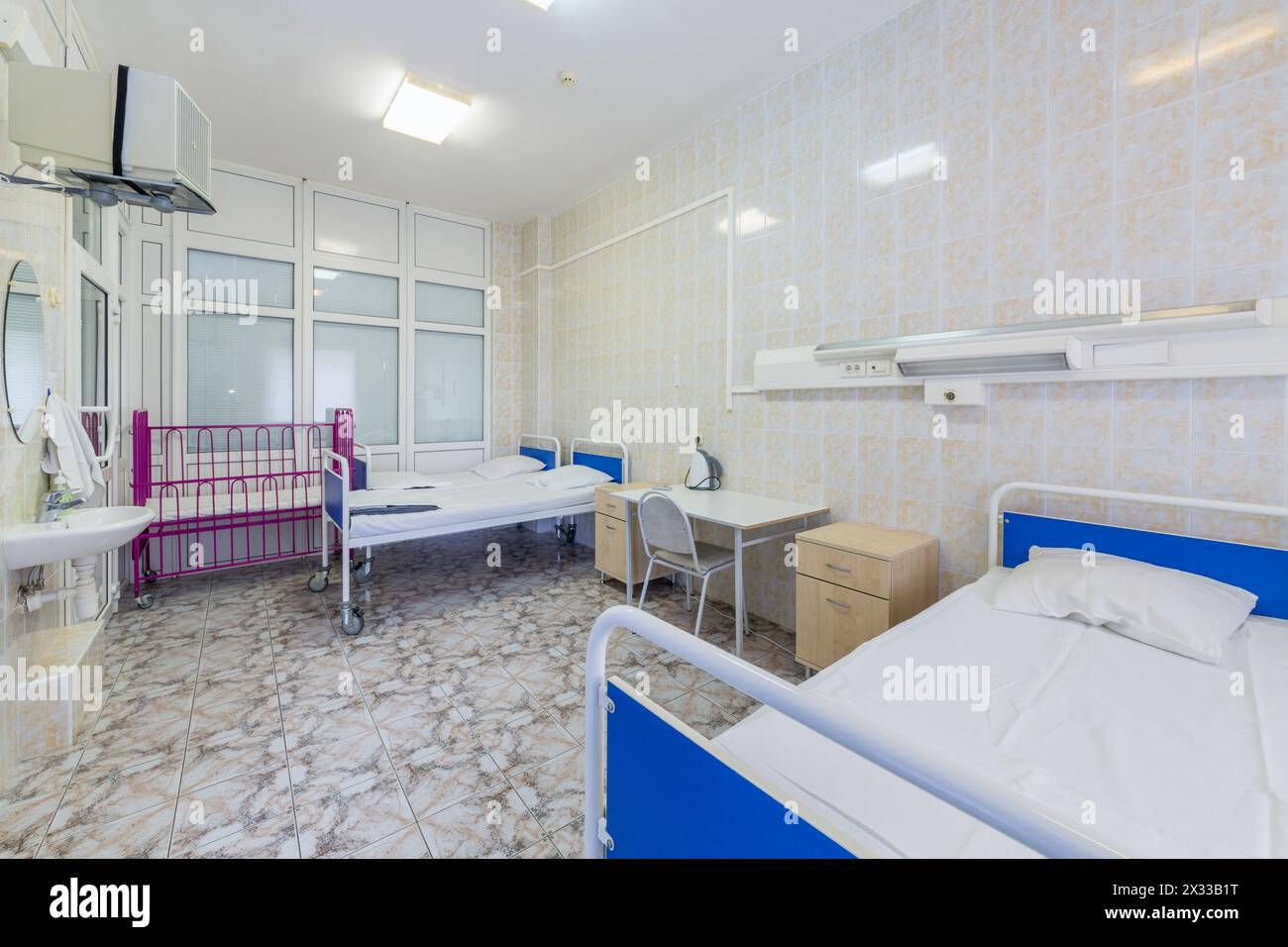 hospital ward with beds and tables Stock Photo - Alamy