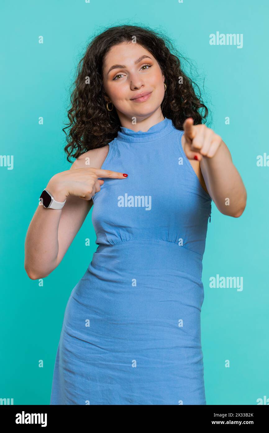 I choose you. Young Caucasian woman pointing finger to camera, looking ...