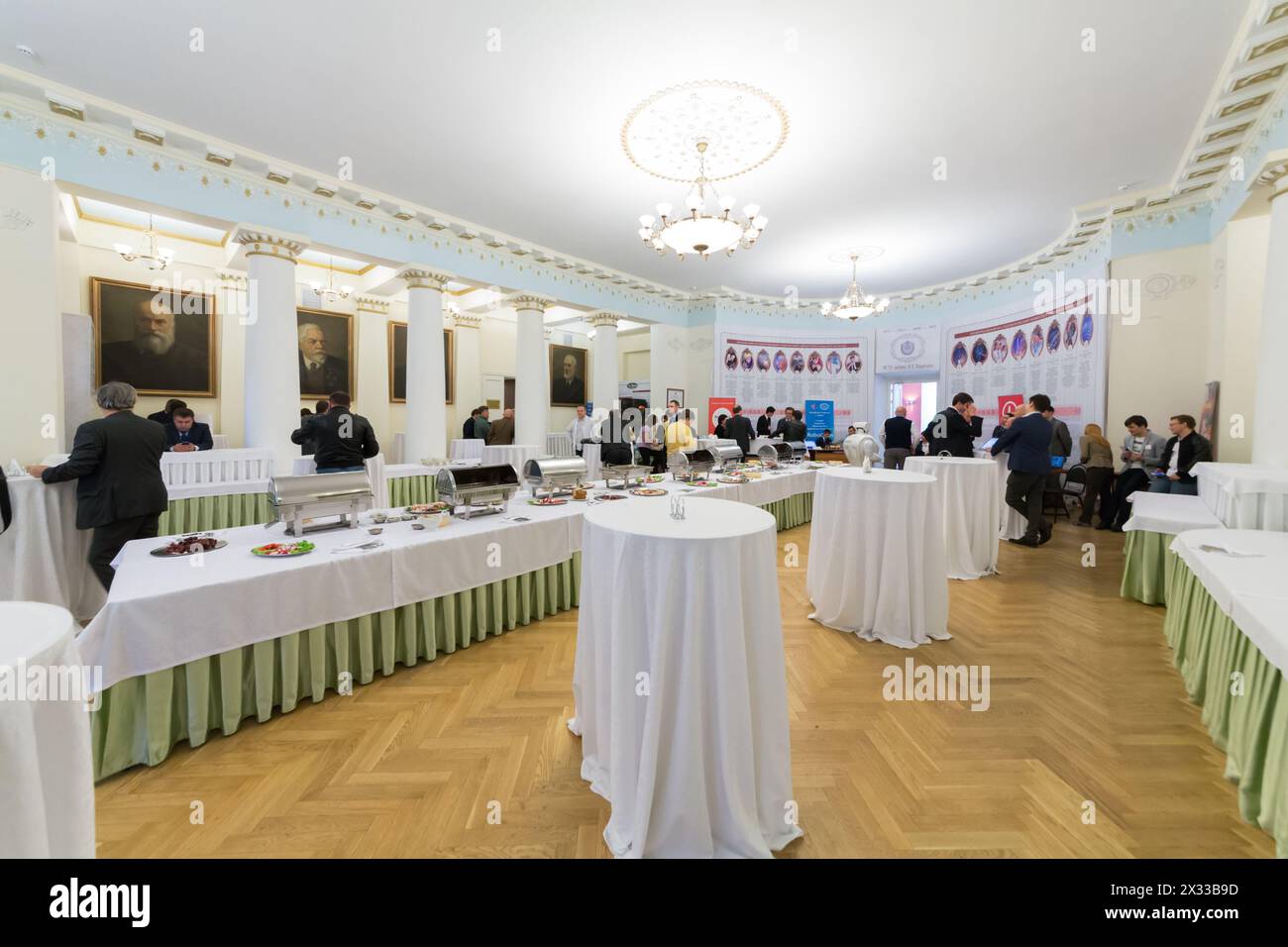 RUSSIA, MOSCOW - 18 MAY, 2015: Many people are standing into light hall ...