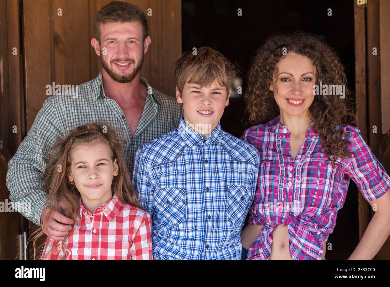 father mother daughter and son closeup family of four portrait focus on ...