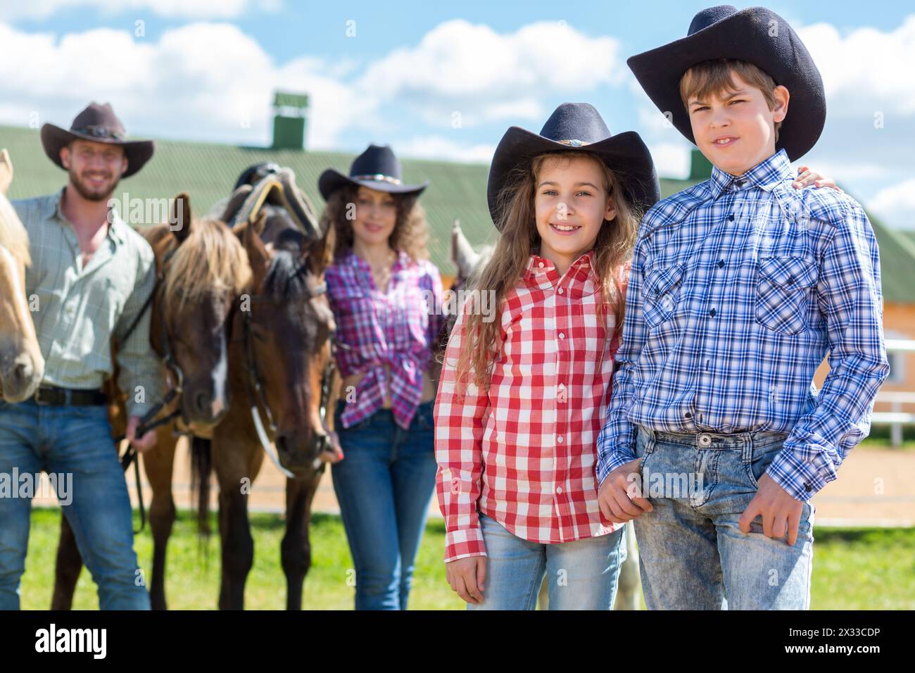 cowboy brother and sister closeup portrait on horseback Stock Photo - Alamy