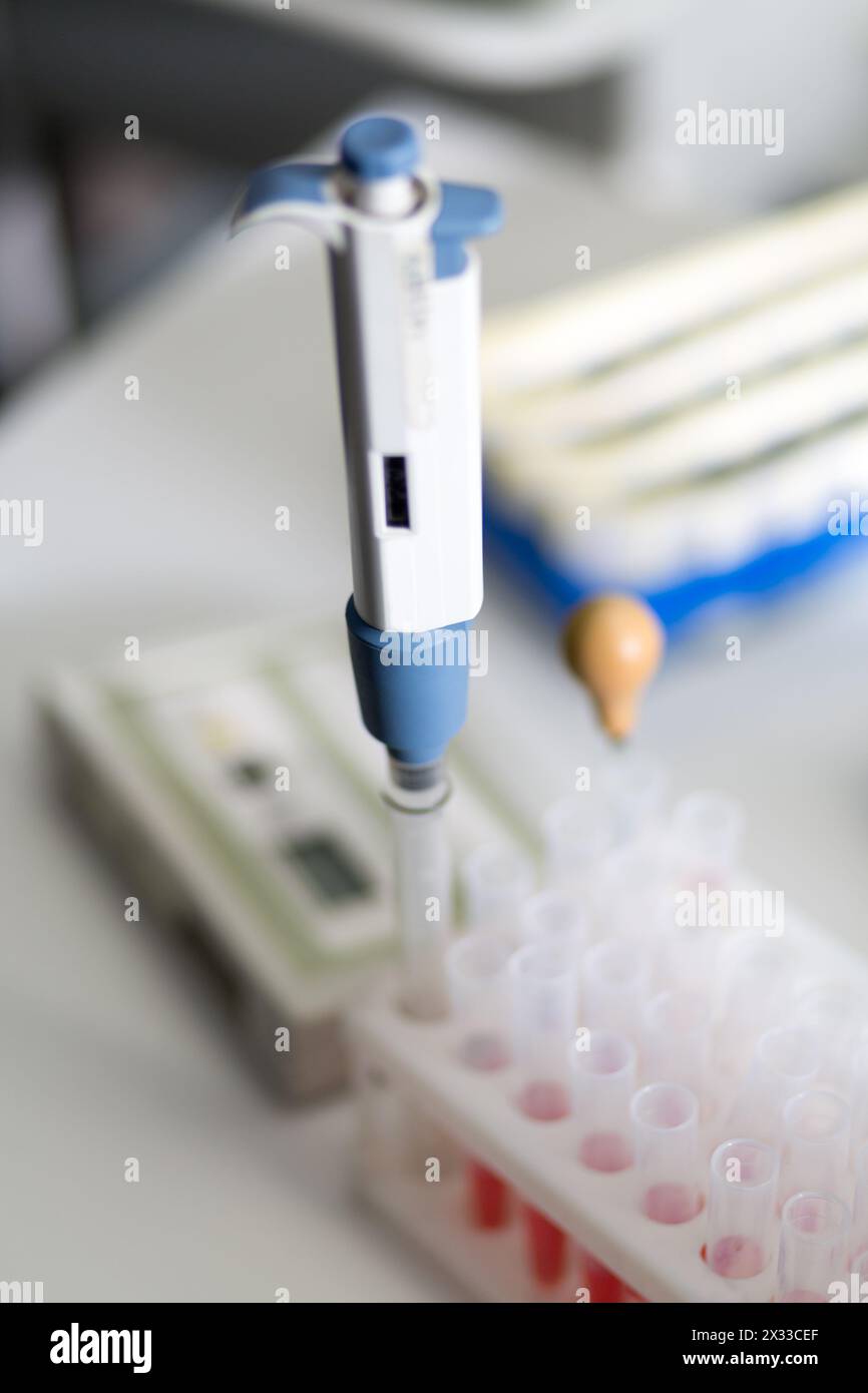 automatic a pipette in a test tube with blood Stock Photo - Alamy