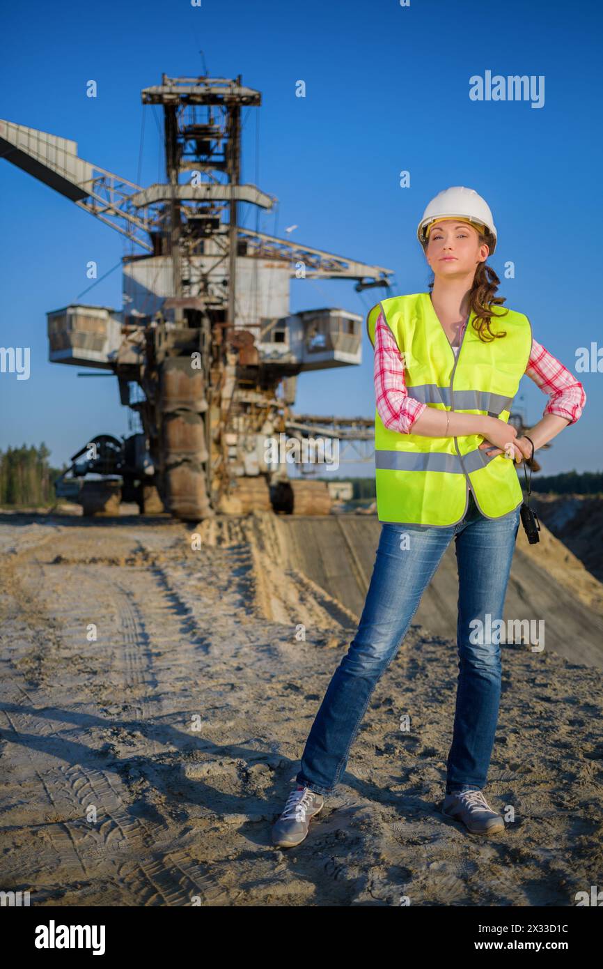 female worker standing on a background of career Stacker Stock Photo ...