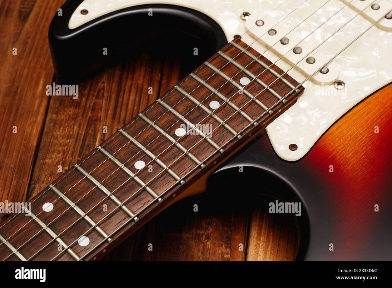 Closeup view of an electric guitar's body and neck Stock Photo - Alamy