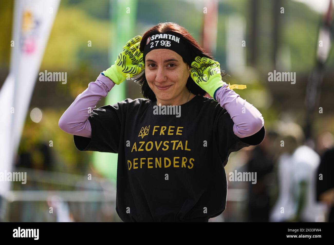Portrait of a cheerful Ukrainian woman running sprint distance at the ...