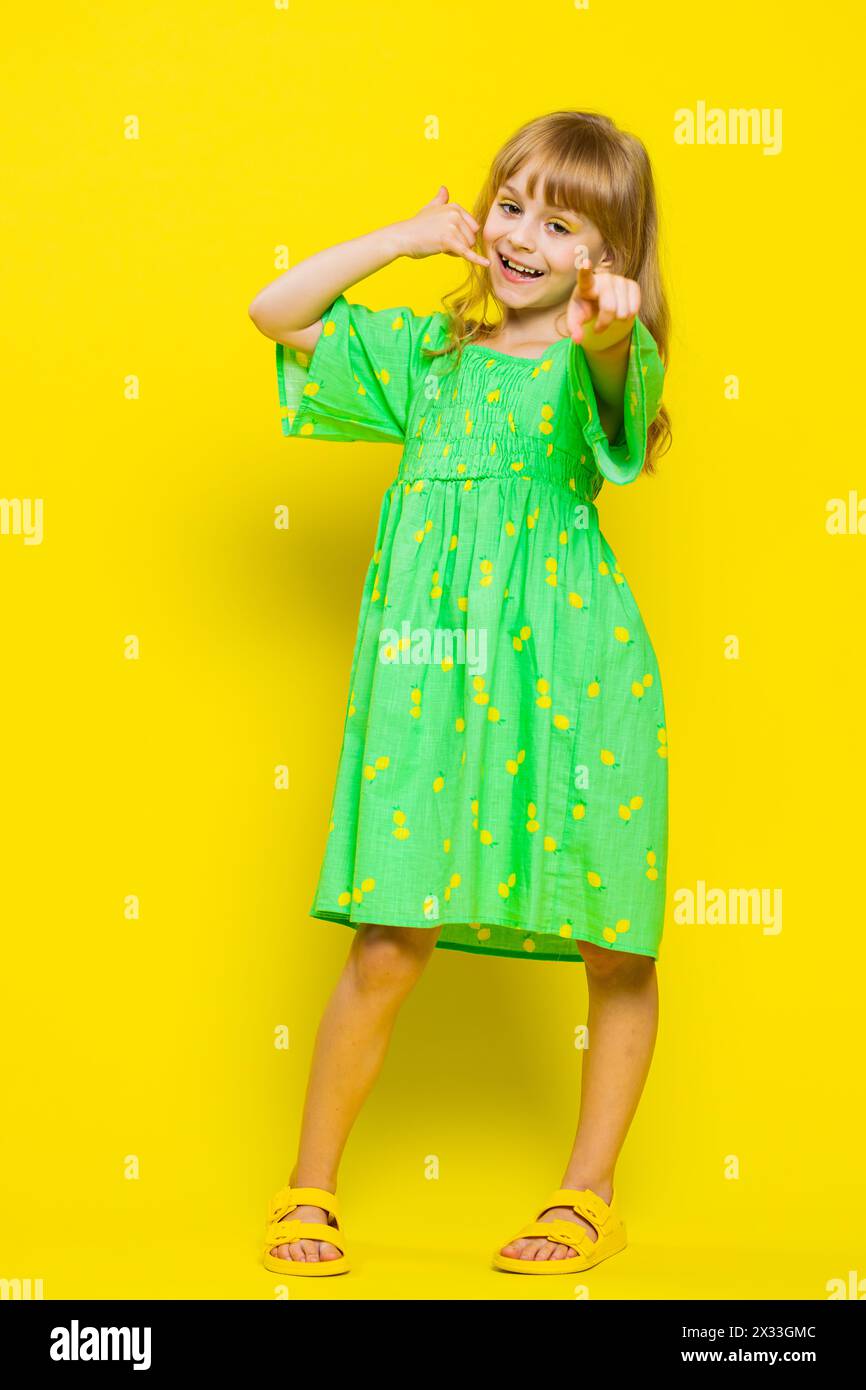 Call me, here is contact number. Blonde child girl kid looking at ...