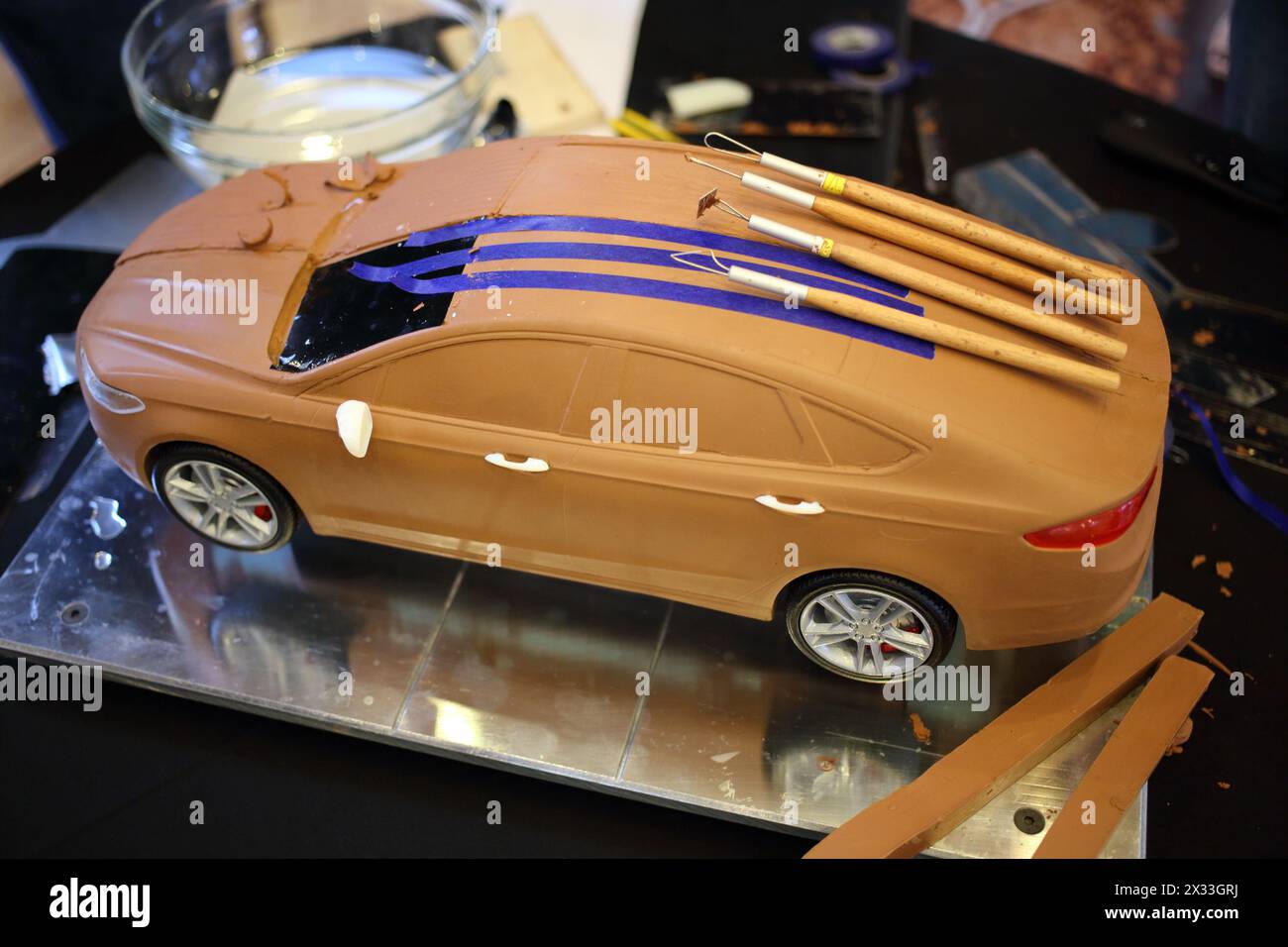 RUSSIA, MOSCOW – 4 DEC, 2014: Ford car model made of clay with tools on ...