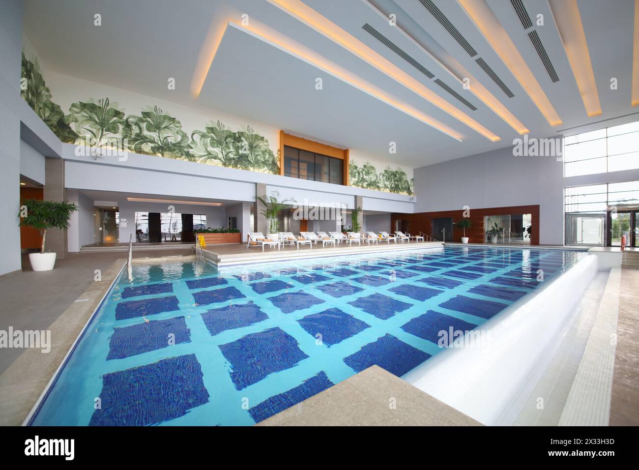 SOCHI, RUSSIA - JUL 27, 2014: Room with an indoor pool and sun loungers ...