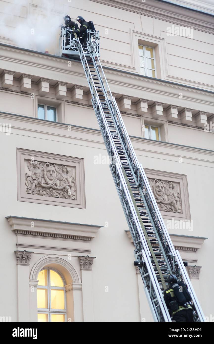 MOSCOW - December 8, 2014: Firefighters at the fire stairs rise to the ...