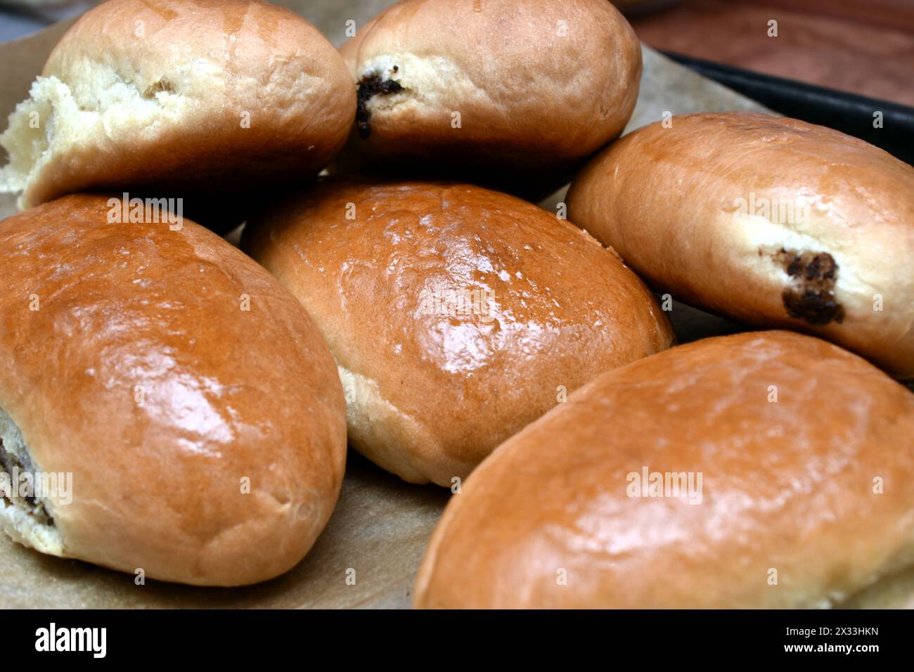 Oven baked buns filled with poppy seeds and sugar Stock Photo - Alamy