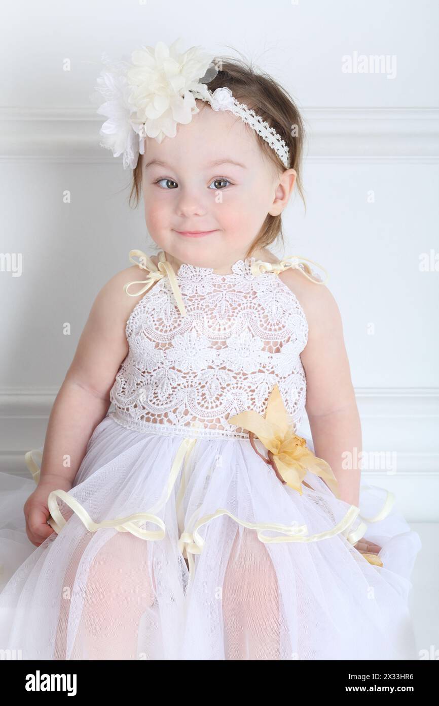 Child sitting on ledge hi-res stock photography and images - Alamy