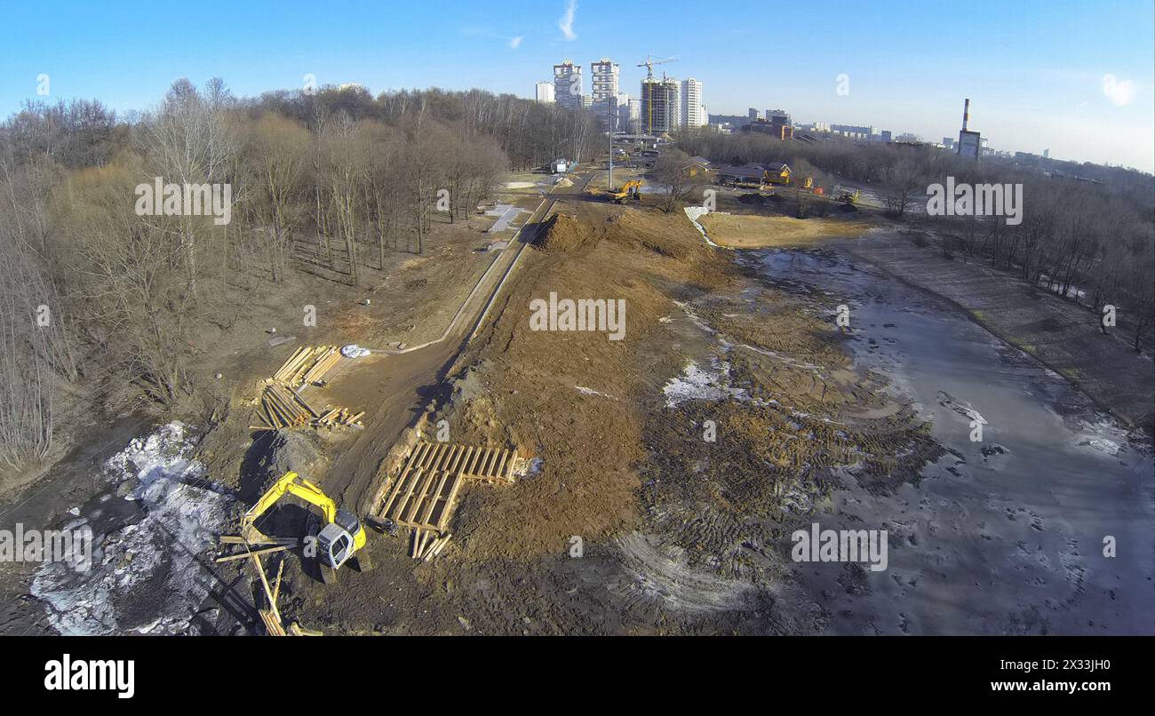 Aerial view of the construction near forest with bald trees Stock Photo ...