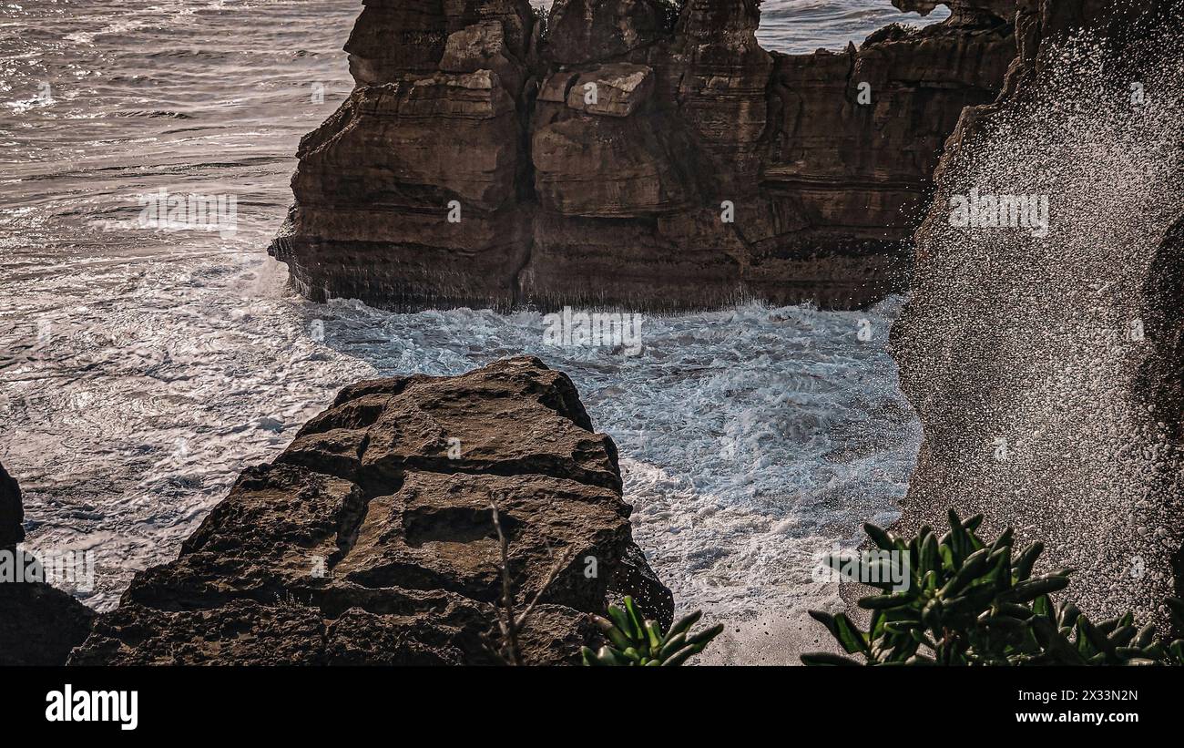 Splash Of Waves Crashing Against The Cliff At Pancake Rocks and ...