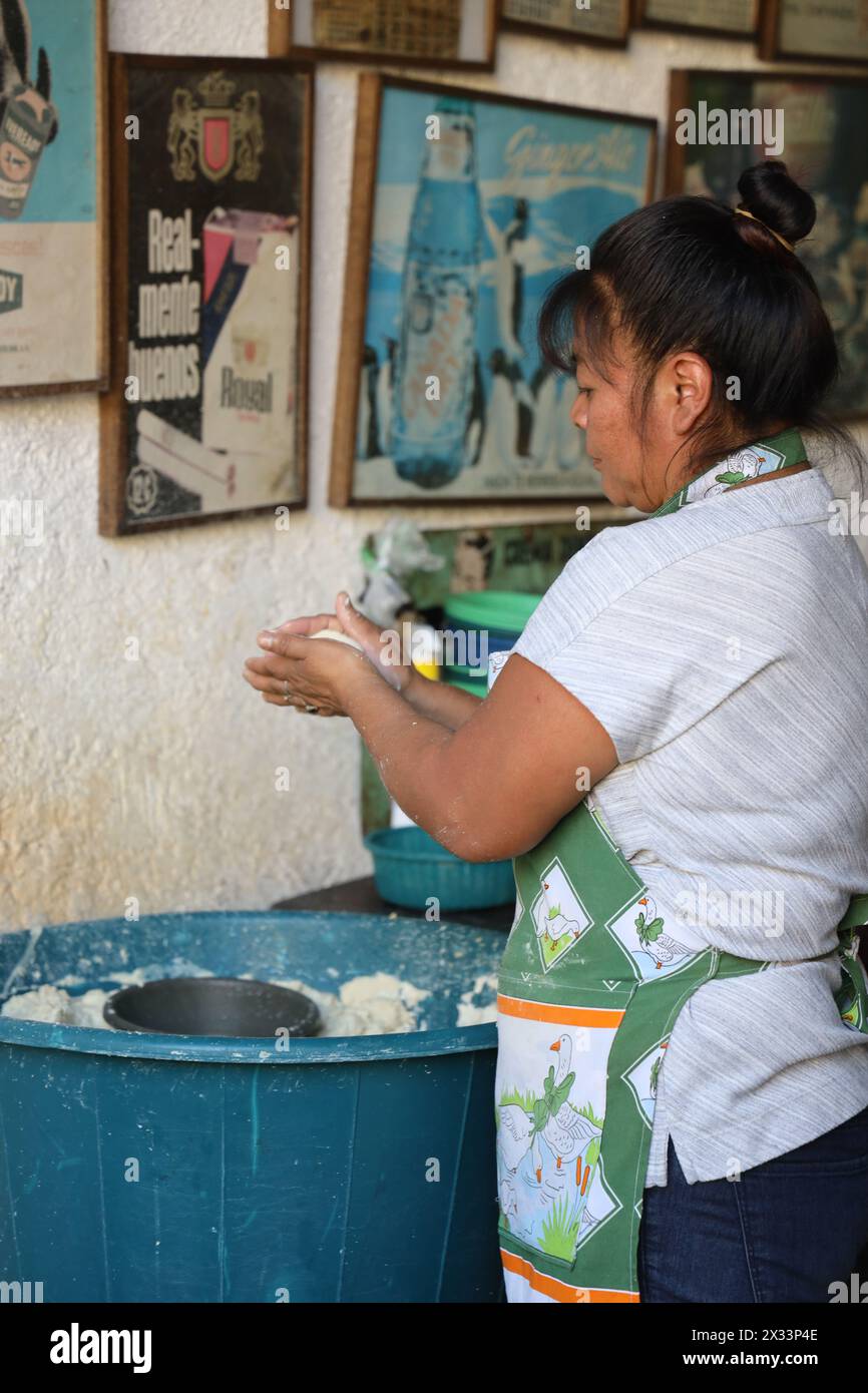 Guatemalan woman making and cooking traditional tortillas. Antigua ...