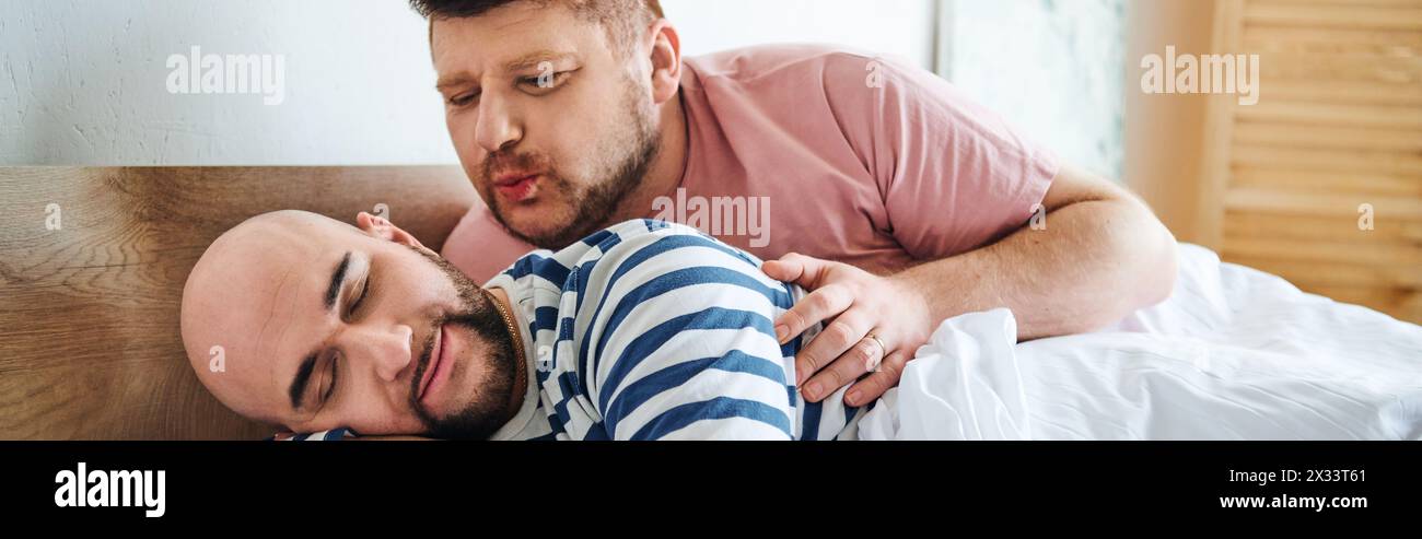 Happy gay couple cuddling on hi-res stock photography and images - Alamy