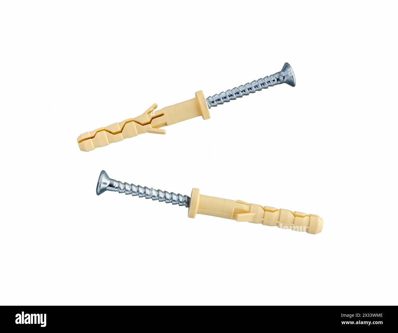 Screws and plastic dowels on white background Stock Photo - Alamy