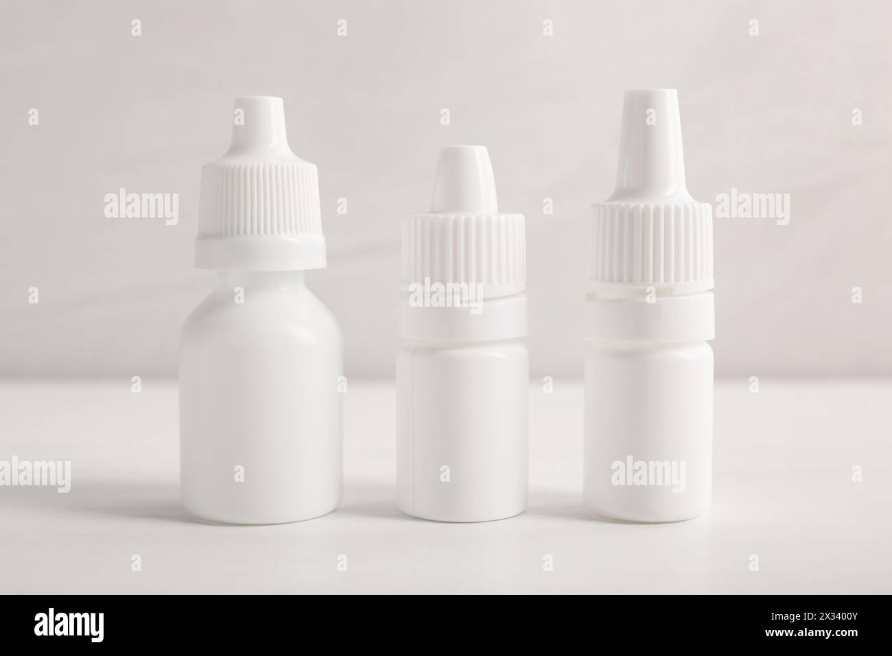 Bottles of medical drops on white background Stock Photo - Alamy