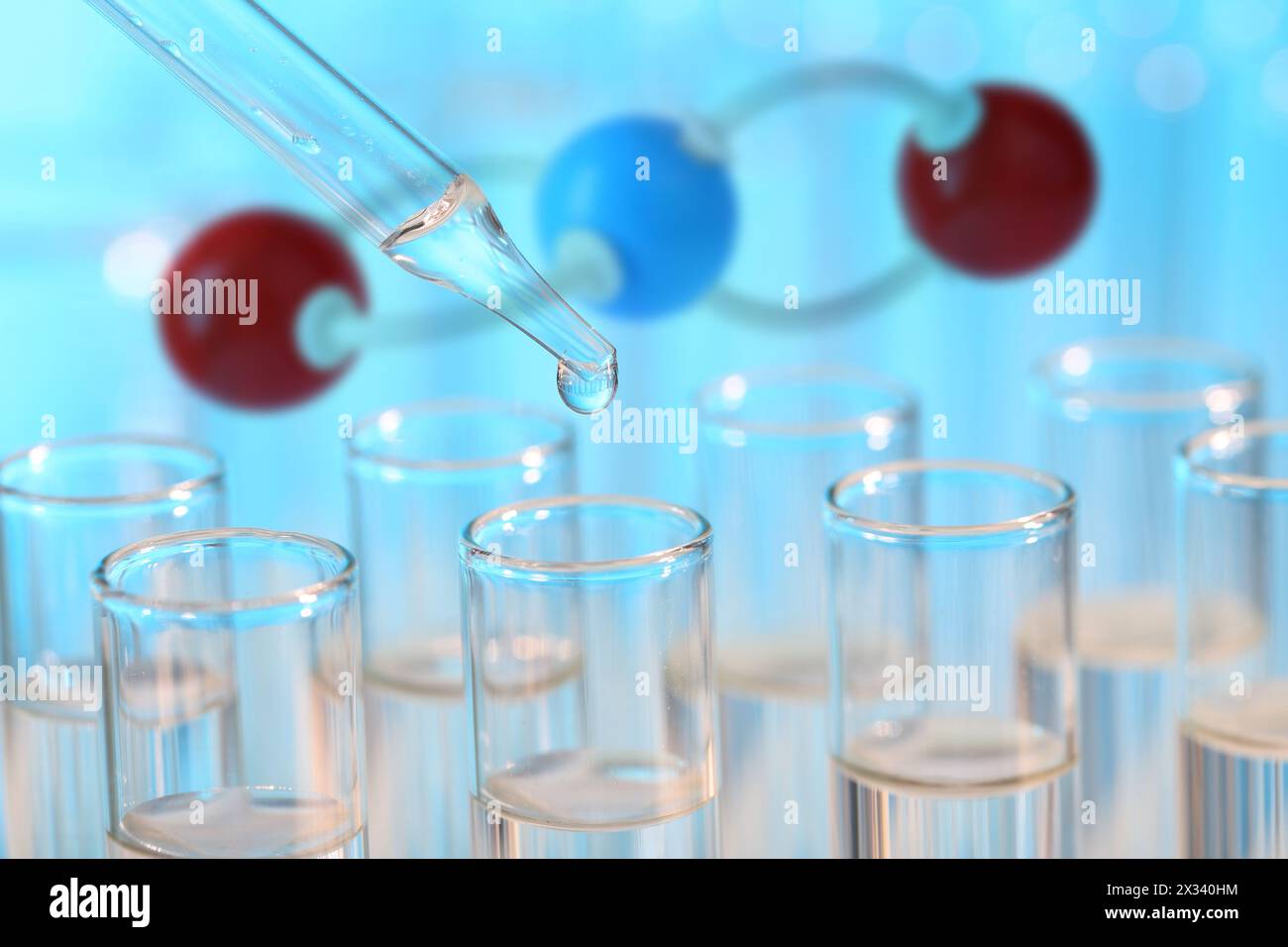 Test tubes and molecule model in laboratory, closeup Stock Photo - Alamy