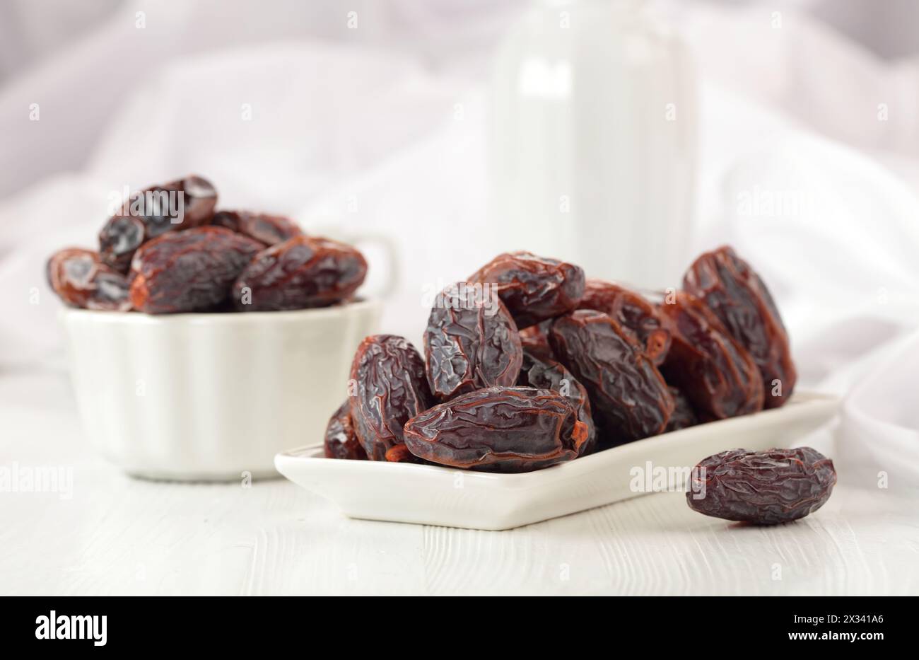 Dried medjool dates on a white kitchen table Stock Photo - Alamy