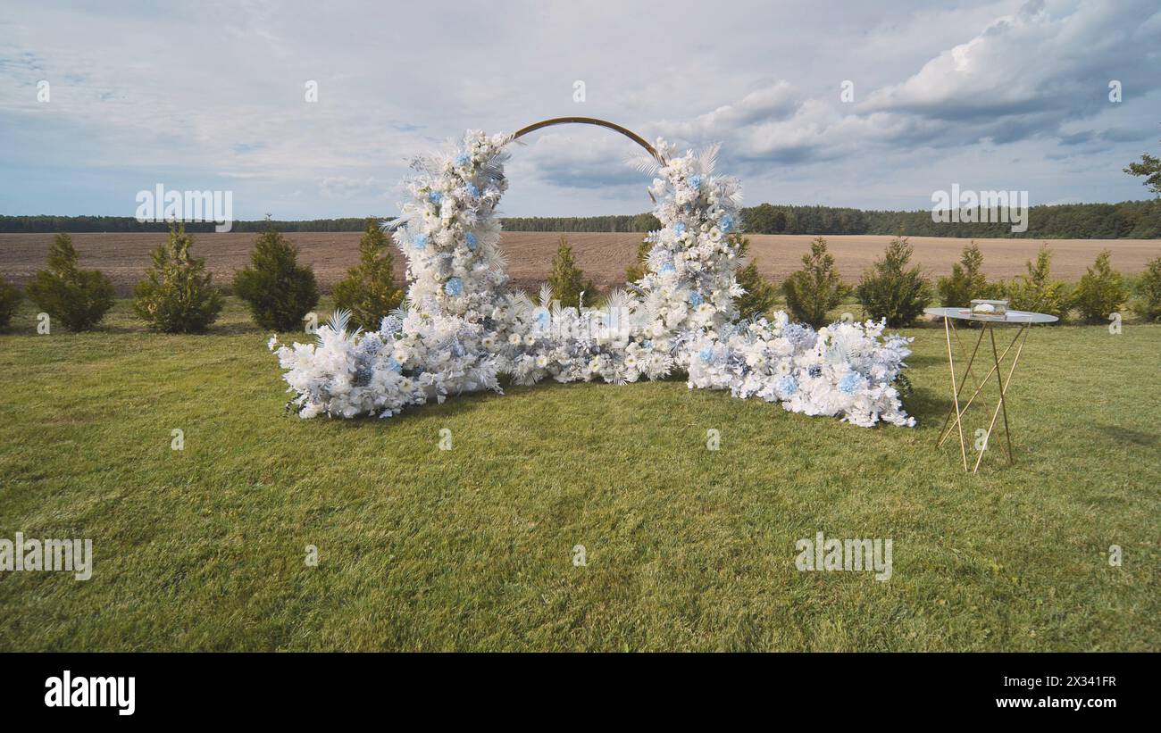 White wedding arch before the ceremony Stock Photo - Alamy