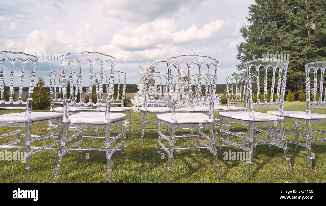 Chairs with wedding arch before the ceremony Stock Photo - Alamy
