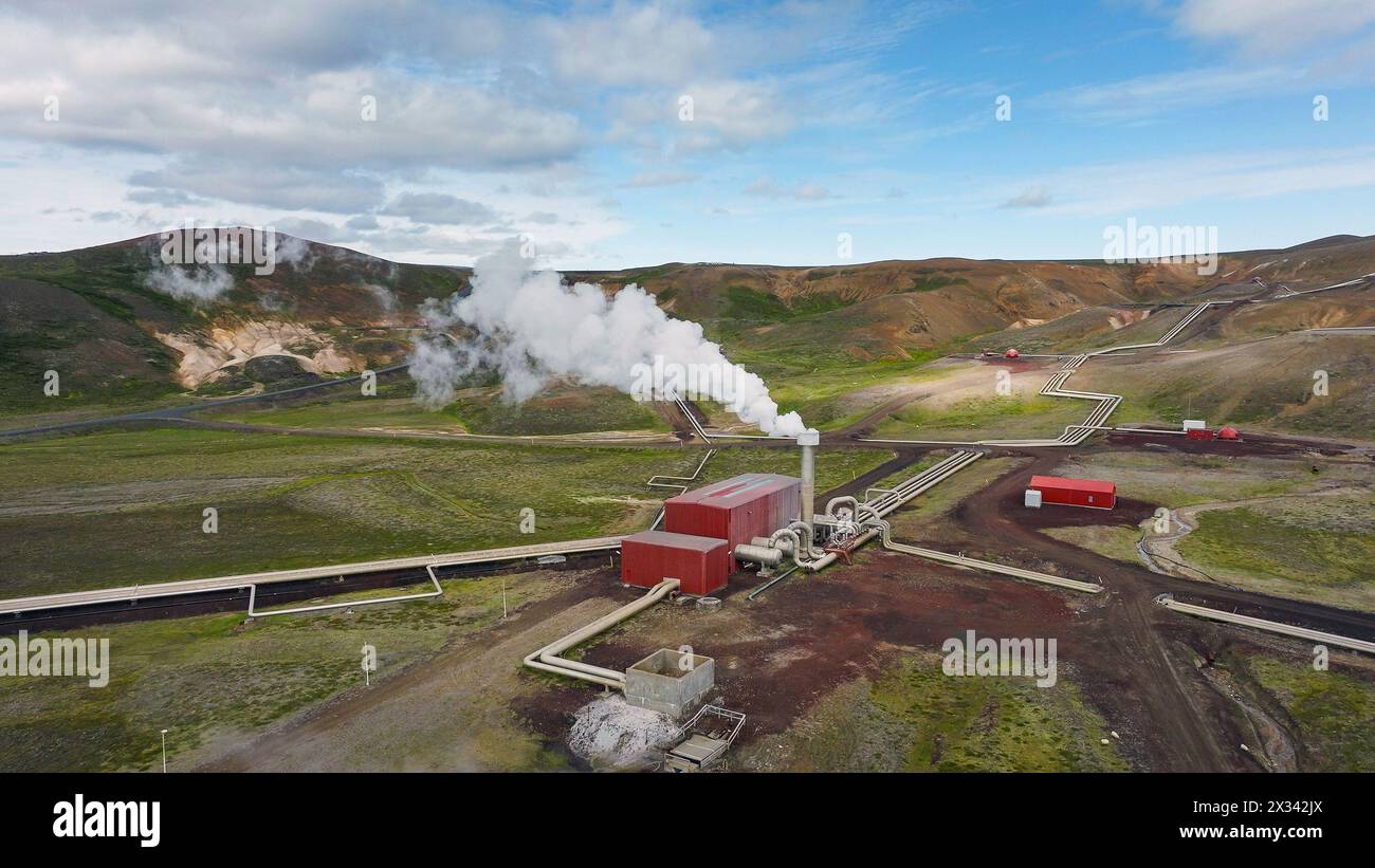 Geothermal power station in Icelandic landscape, steaming chimneys in ...