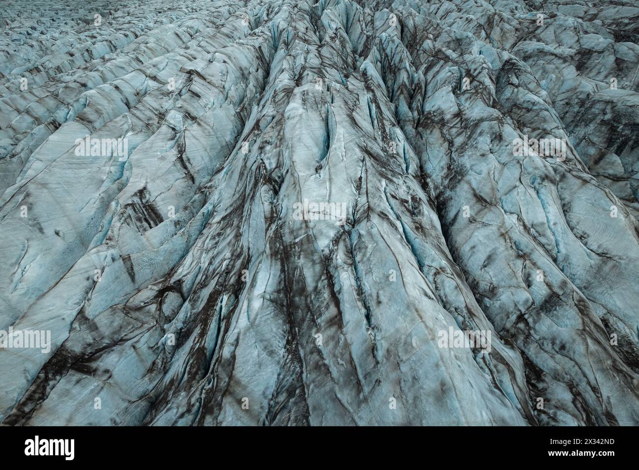 Dark gray volcanic rock formation formed from cooled lava, aerial top ...