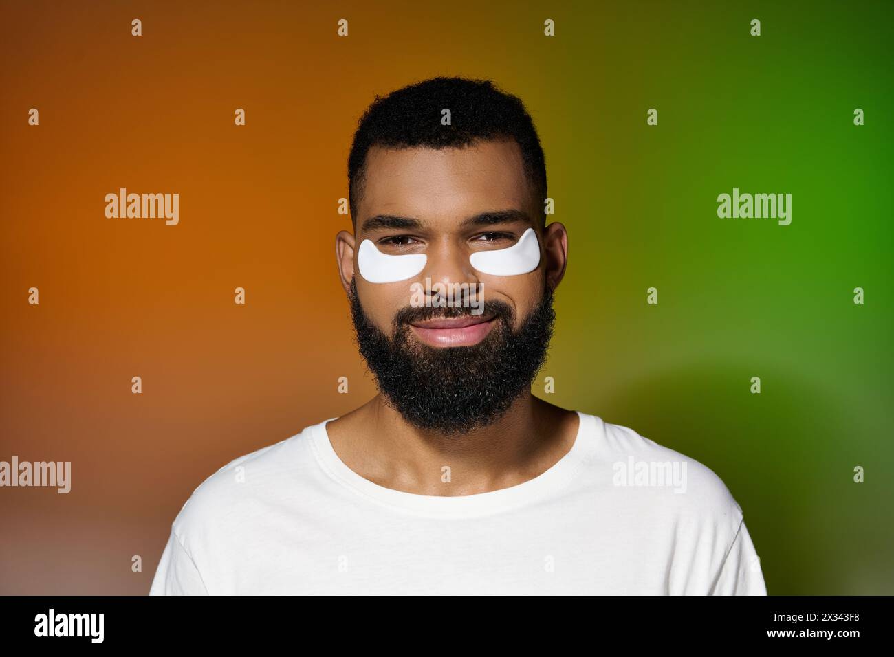 Handsome man with eye patches on his face Stock Photo - Alamy