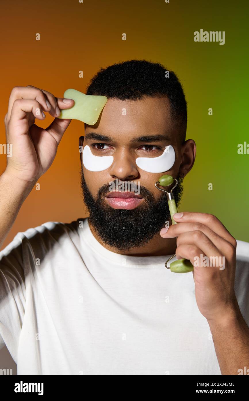 African american bearded man using eye patches and face roller Stock ... African american bearded man using eye patches and face roller Stock ...