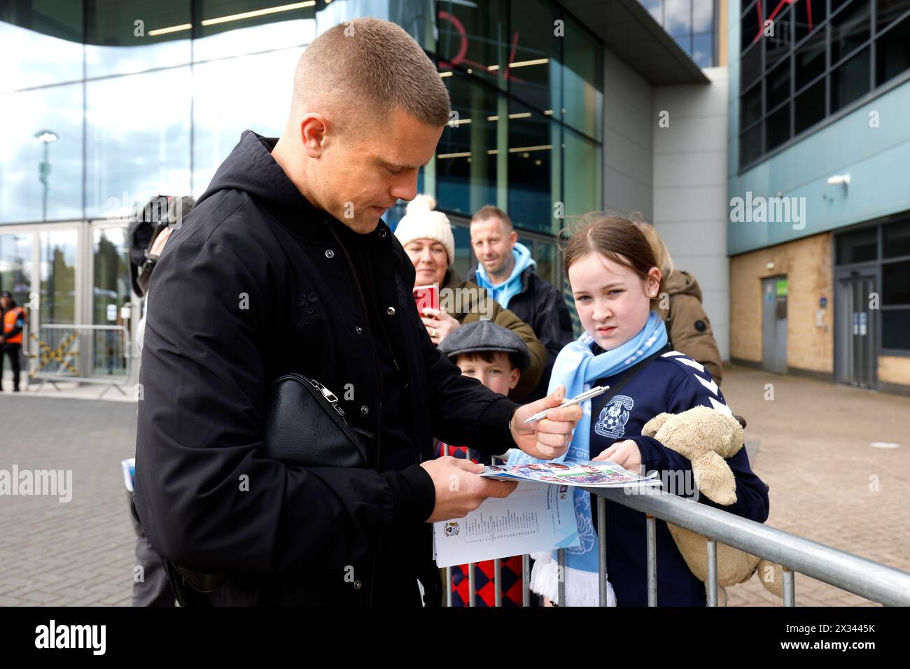 Coventry City's Jake Bidwell signs autographs ahead of the Premier ...