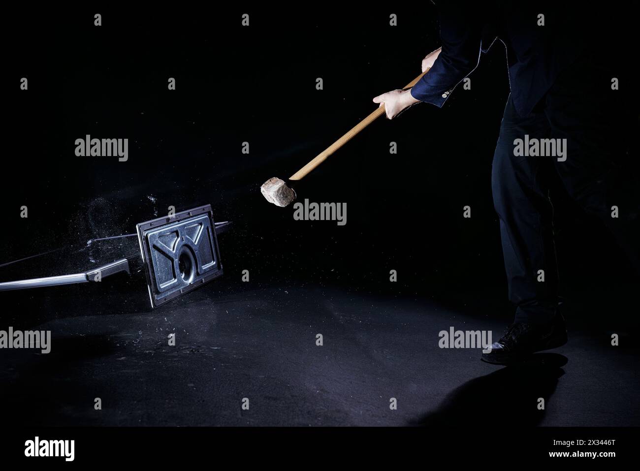 Man hitting a big flat TV screen with a sledgehammer, isolated on a ...