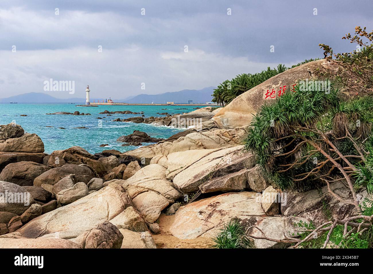 View of the lighthouse in the sea near the rocky shore. Heavenly ...