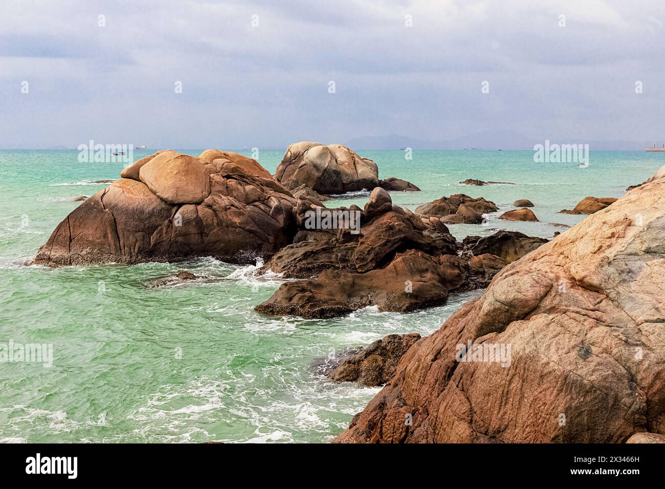 View of large rocks along the shore of the South China Sea. Sky ...