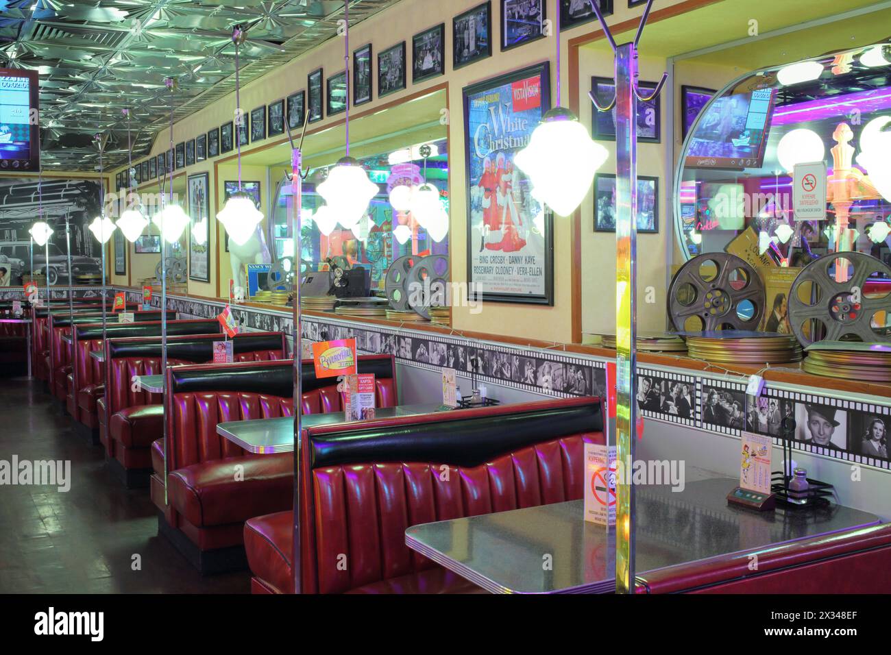 MOSCOW - JAN 21, 2015: Tables with leather red sofas and cinema ...