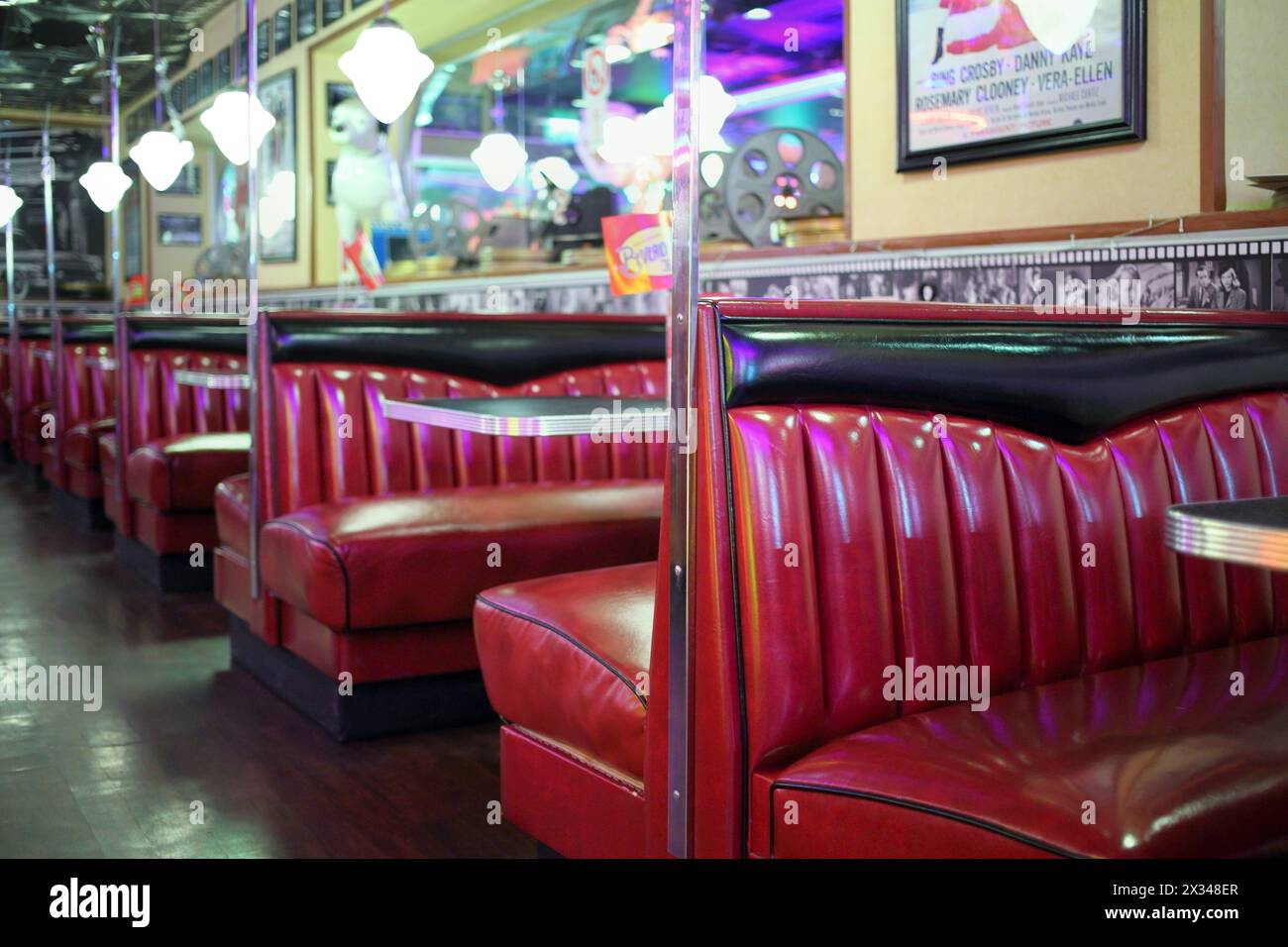 MOSCOW - JAN 21, 2015: Empty rows of leather red sofas with tables in ...