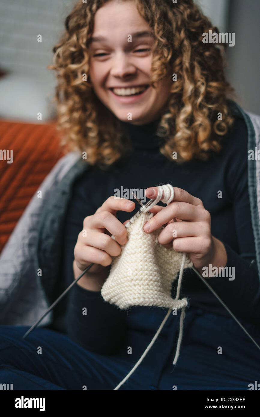 Smiling woman at home enjoy resting home leisure activity sitting on ...