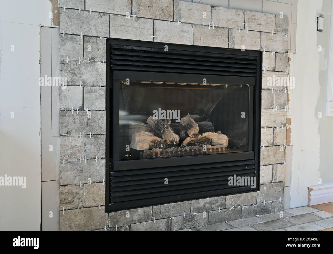 Home renovation project in progress, weekend tiling to update fireplace ...
