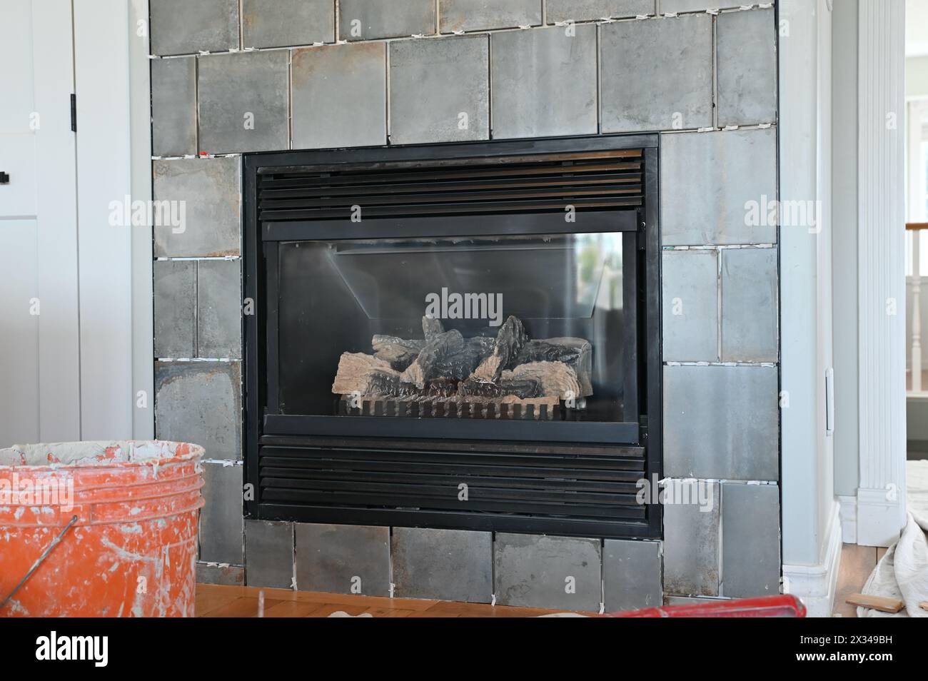 Home renovation project in progress, weekend tiling to update fireplace ...