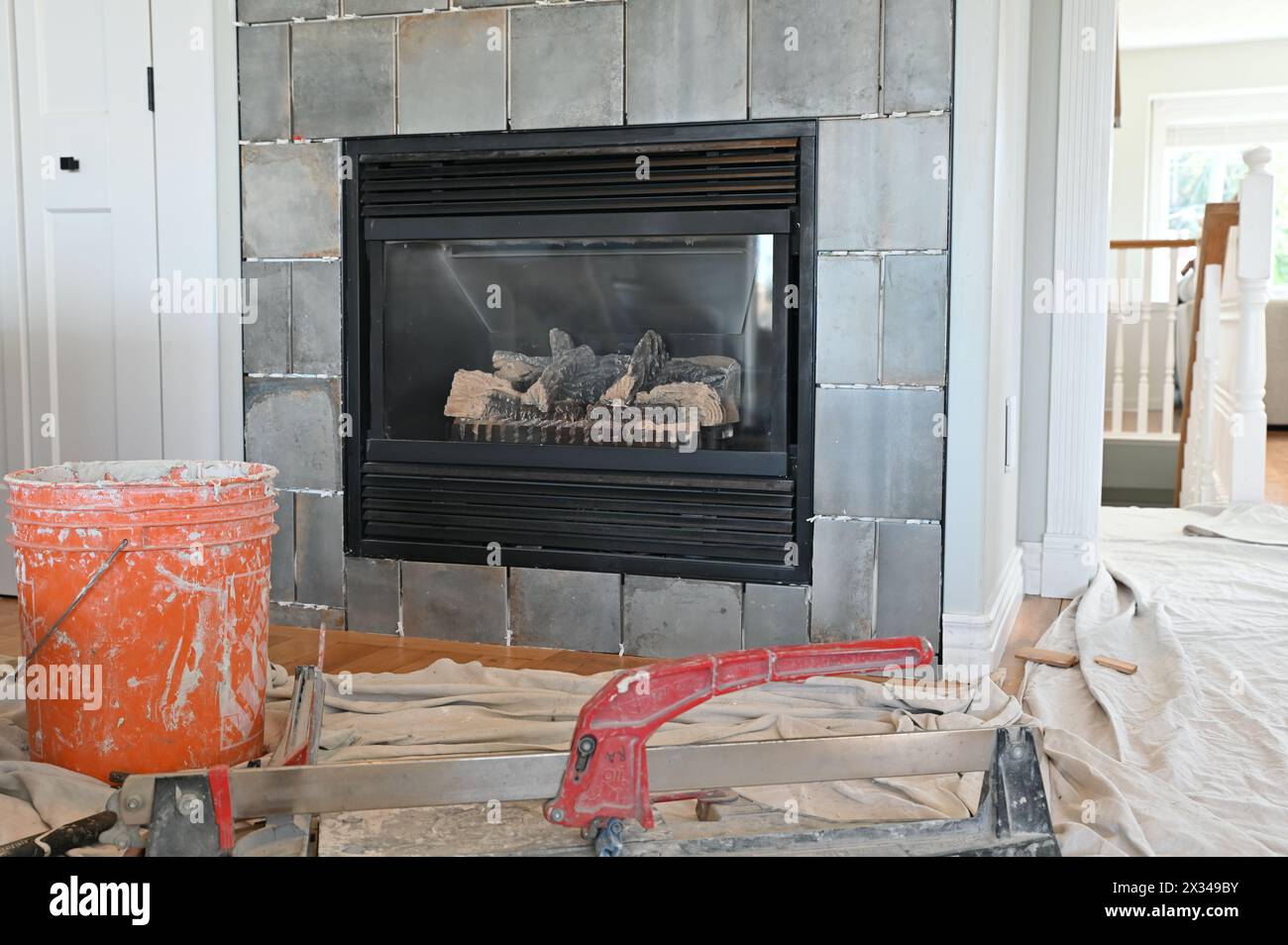 Home renovation project in progress, weekend tiling to update fireplace ...