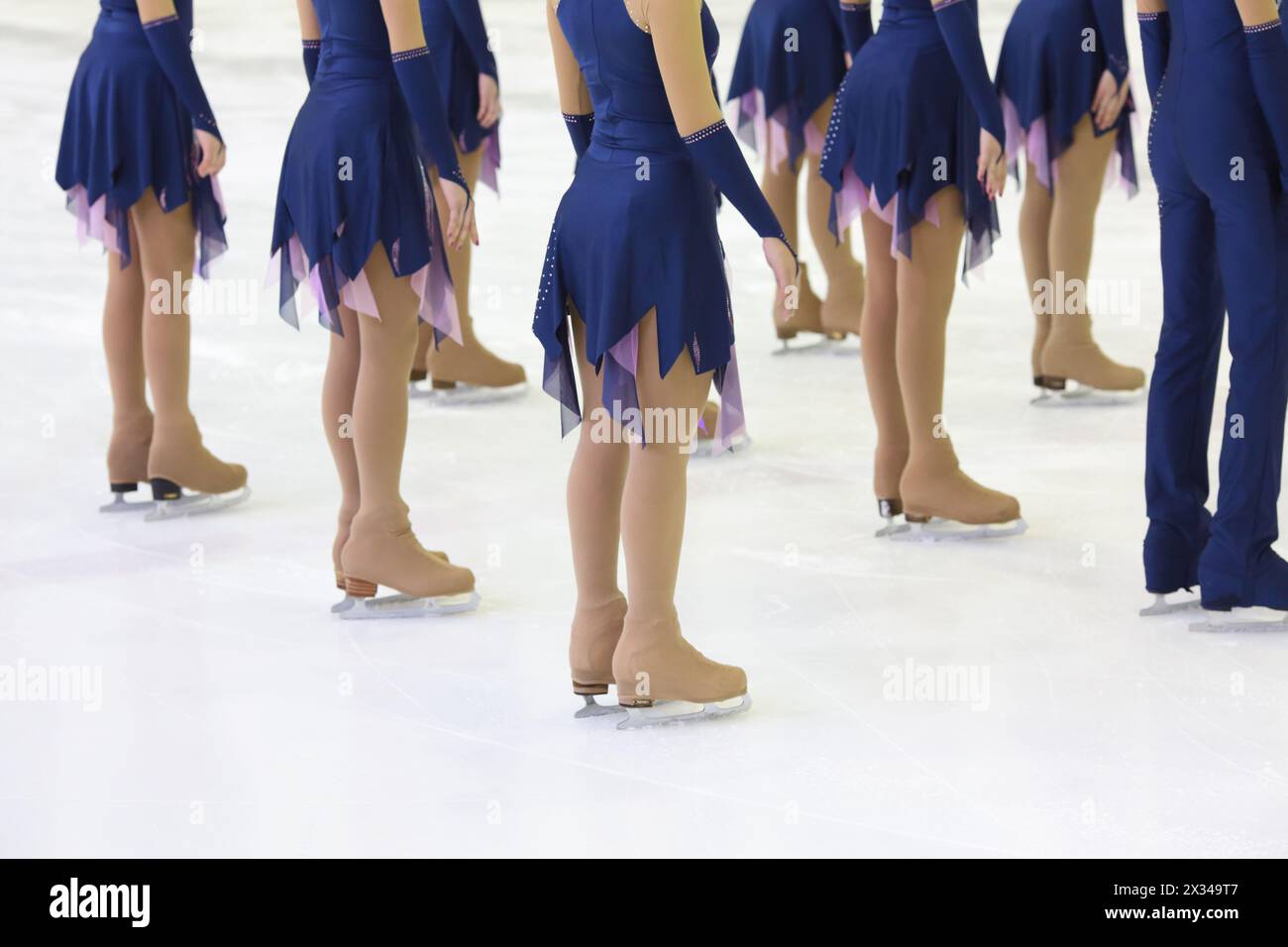Skaters in beautiful costumes and skates on the ice in the sports ...