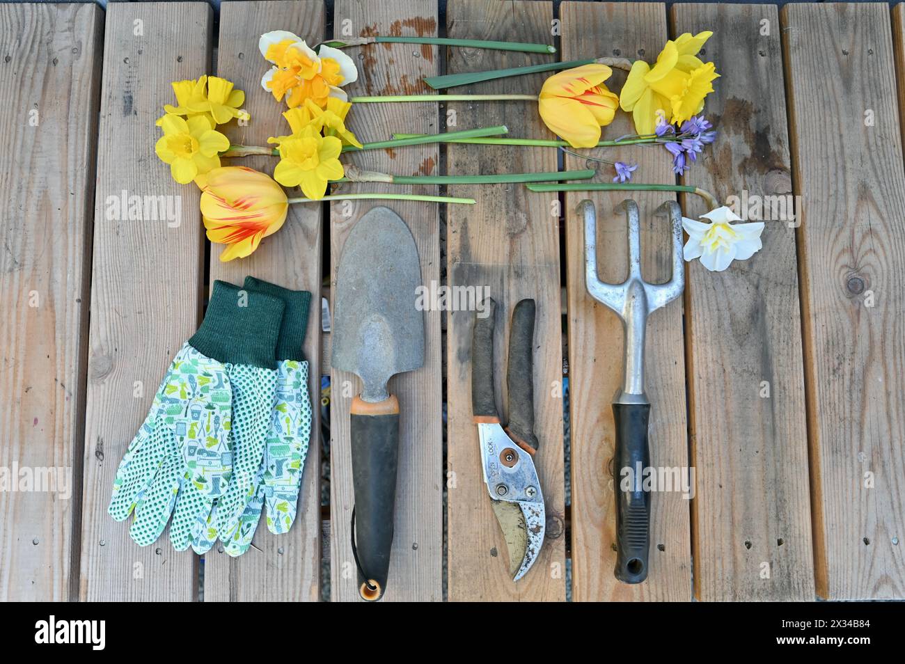 Spring garden potting bench with garden equipment tools for yard work ...