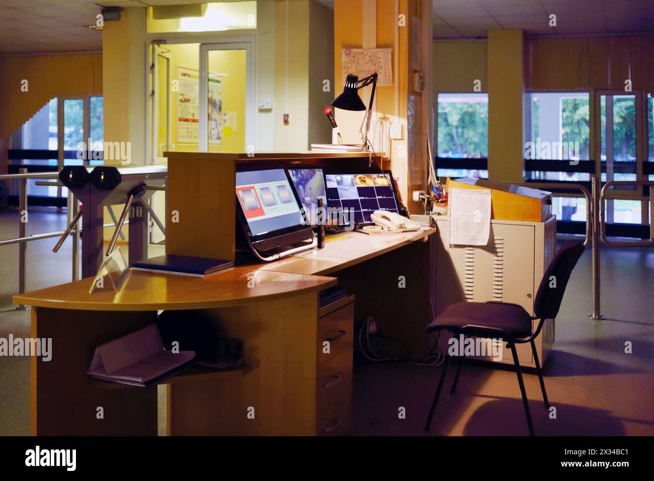 Empty workplace of reception in office building at summer evening Stock ...
